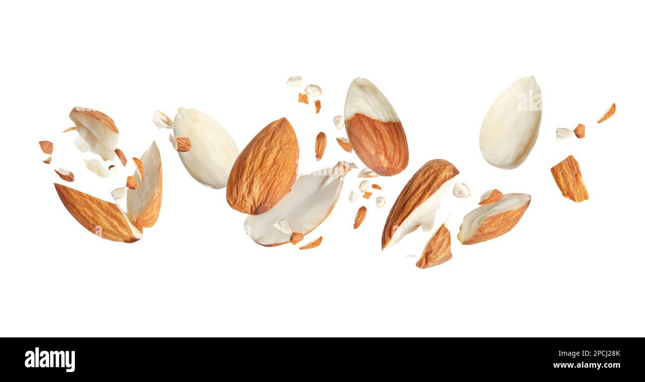 Pieces of tasty almonds falling on white background. Banner design ...