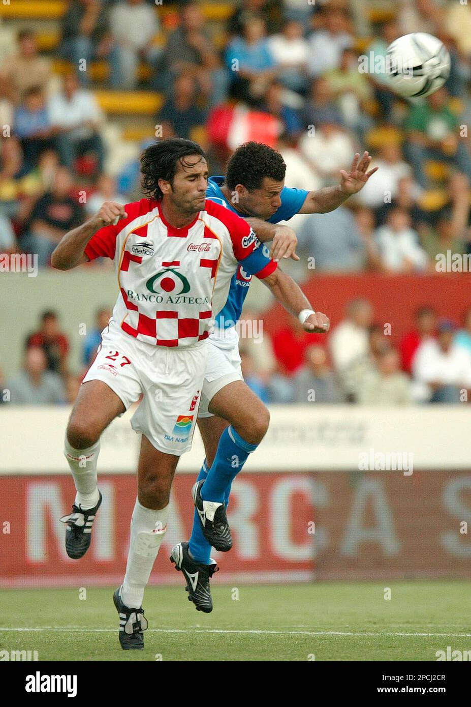 Tecos player Carlos Leano, left, battles for the ball against Cruz Azul ...