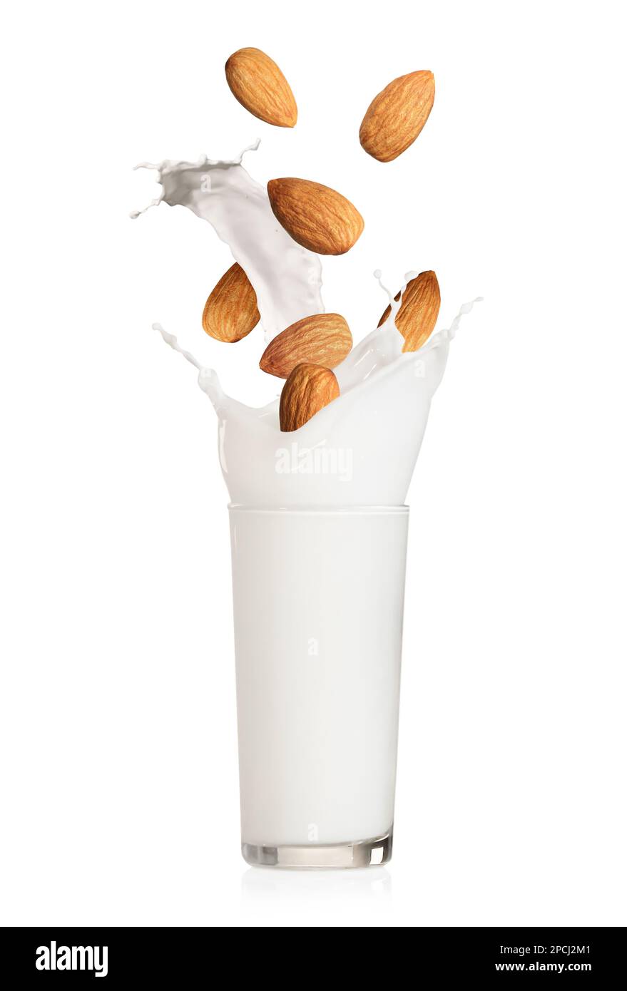 Delicious almond milk and nuts on white background Stock Photo - Alamy