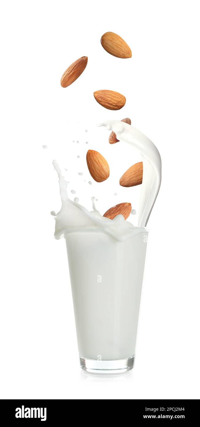 Delicious almond milk and nuts on white background Stock Photo - Alamy