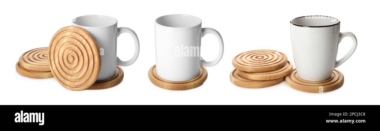 Set with stylish wooden cup coasters and mugs on white background ...