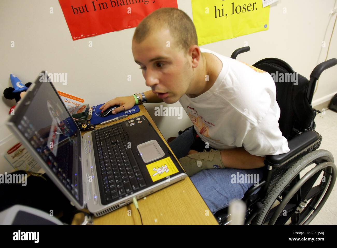 Army staff sergeant Eric Cagle, 26, works on his computer at the ...