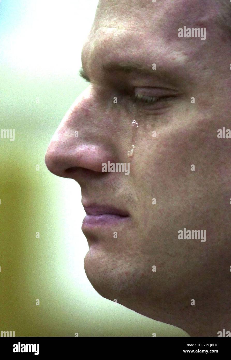 Tears roll down Christian Longo's cheek while listening to emotional ...