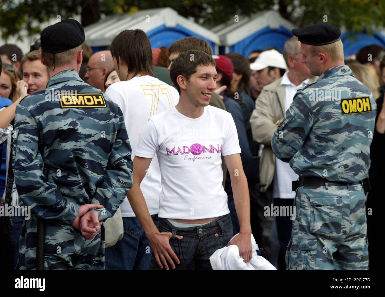 A ticket holder of the first ever concert of Madonna in Russia stands ...
