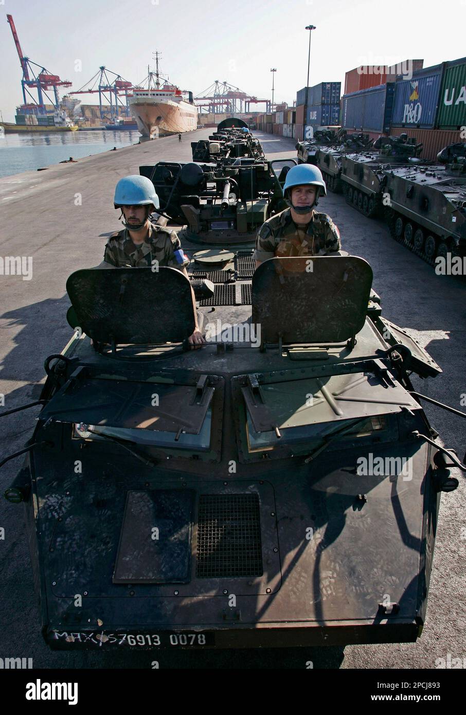 French U.N. peacekeepers sit atop armored personnel carriers that were ...