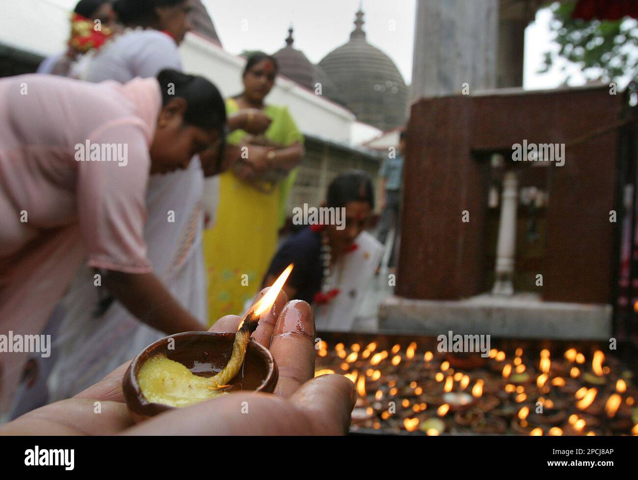 A Hindu devotee performs rituals at Kamakhya temple in Gauhati, India ...