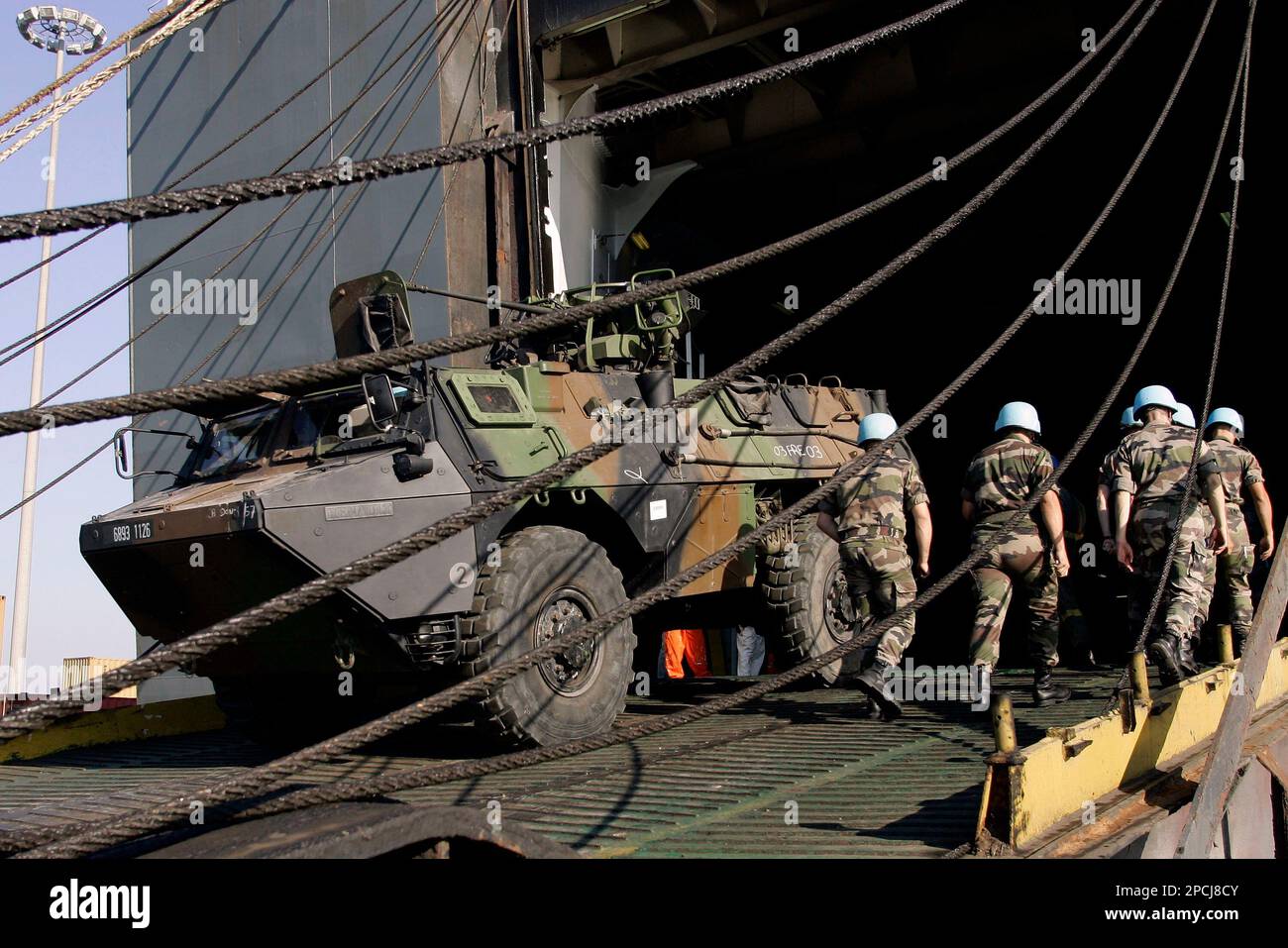 An armored personnel carrier is unloaded as French U.N. peacekeepers ...