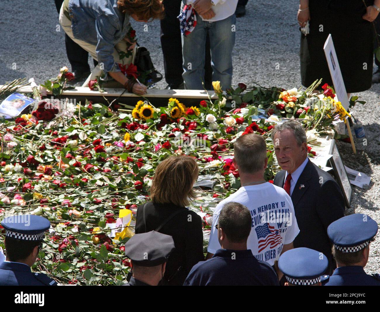 New York City Mayor Michael Bloomberg, right facing camera, speaks with ...