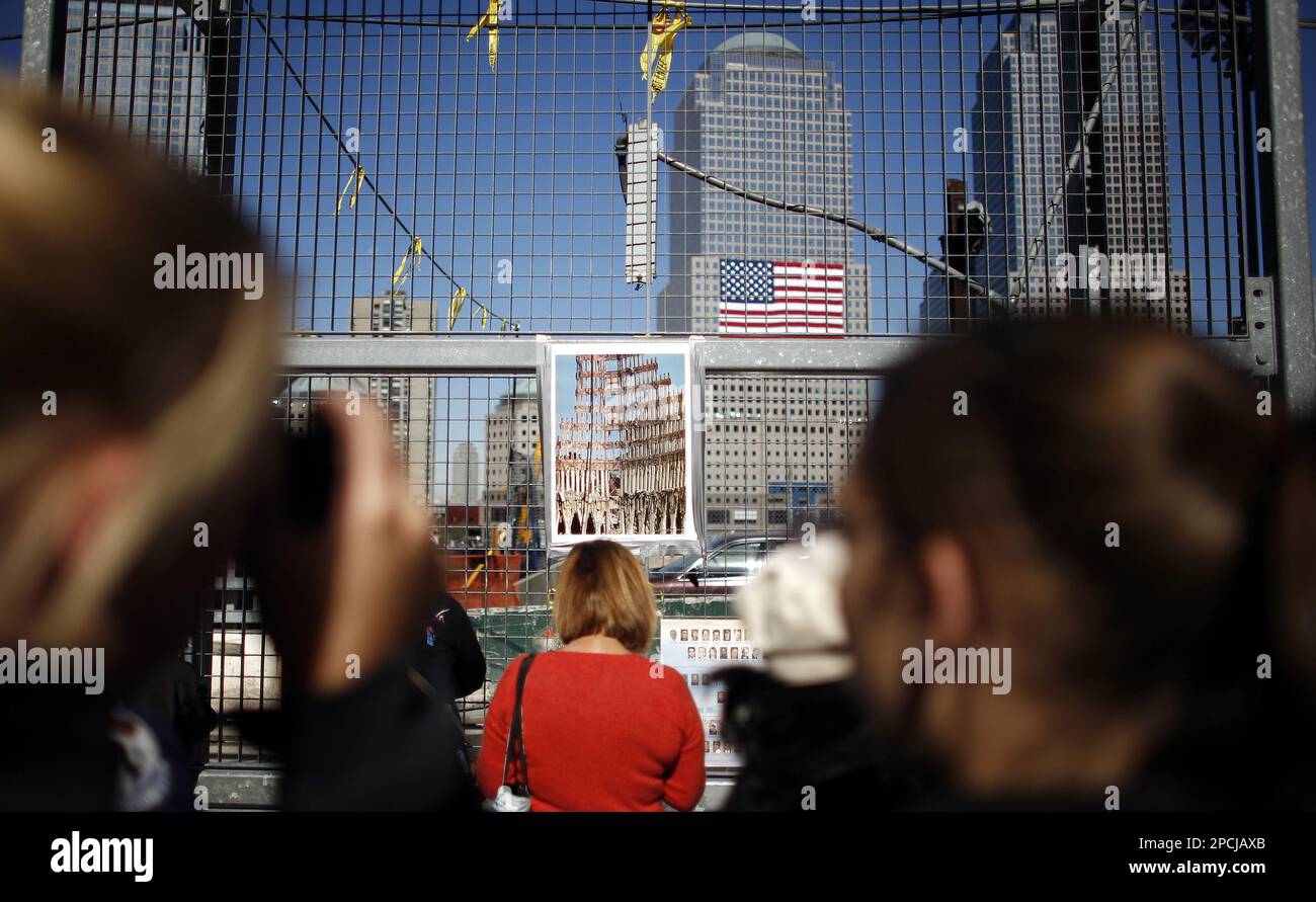 Wreckage of the World Trade Center is shown in a photograph hanging ...