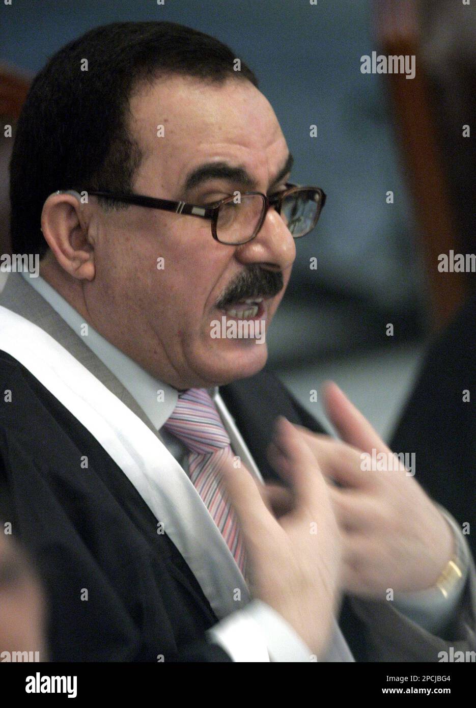 Chief judge Abdullah al-Amiri speaks during the trial of Saddam Hussein ...