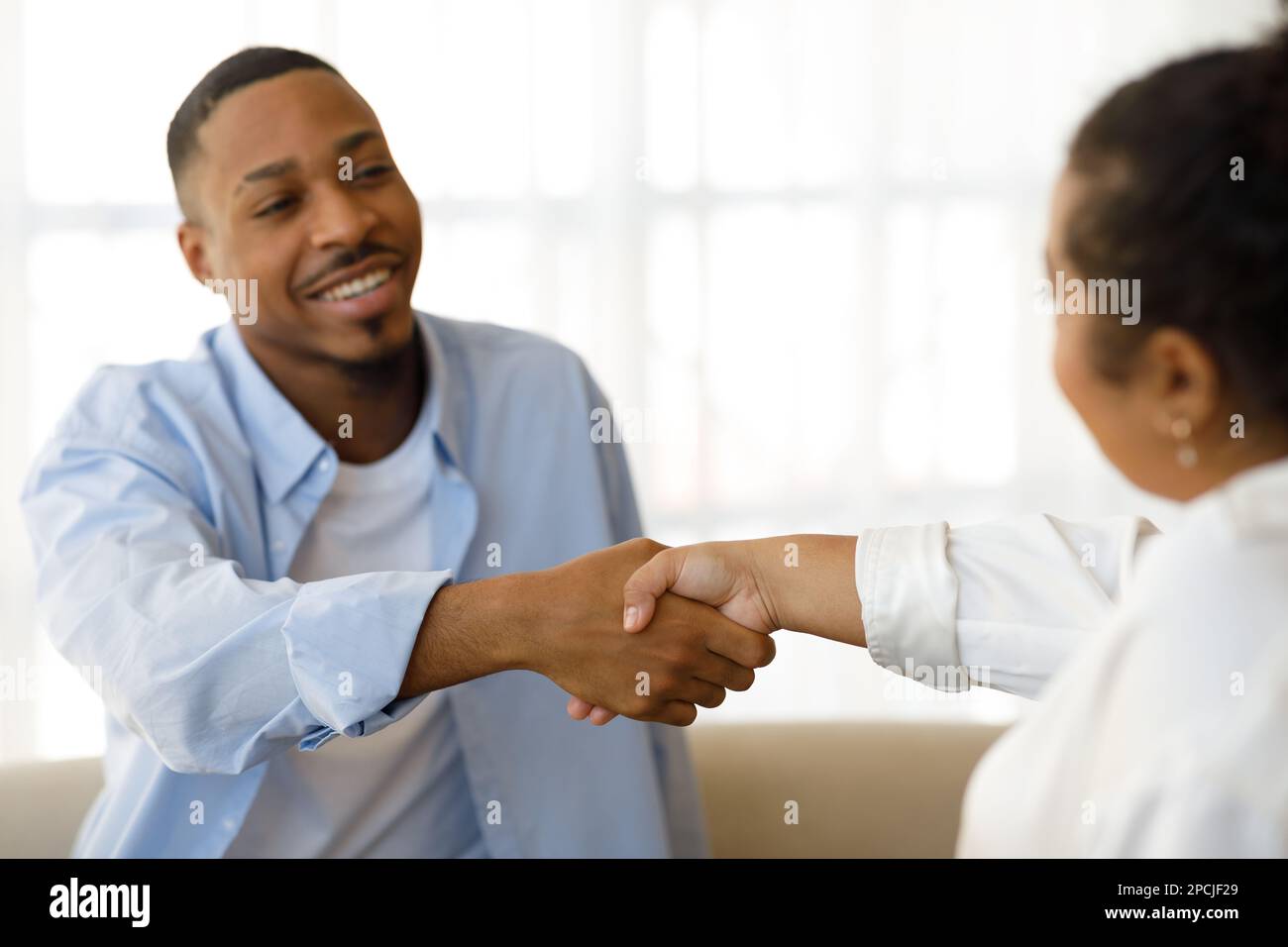 Psychologist and patient shaking hands hi-res stock photography and ...