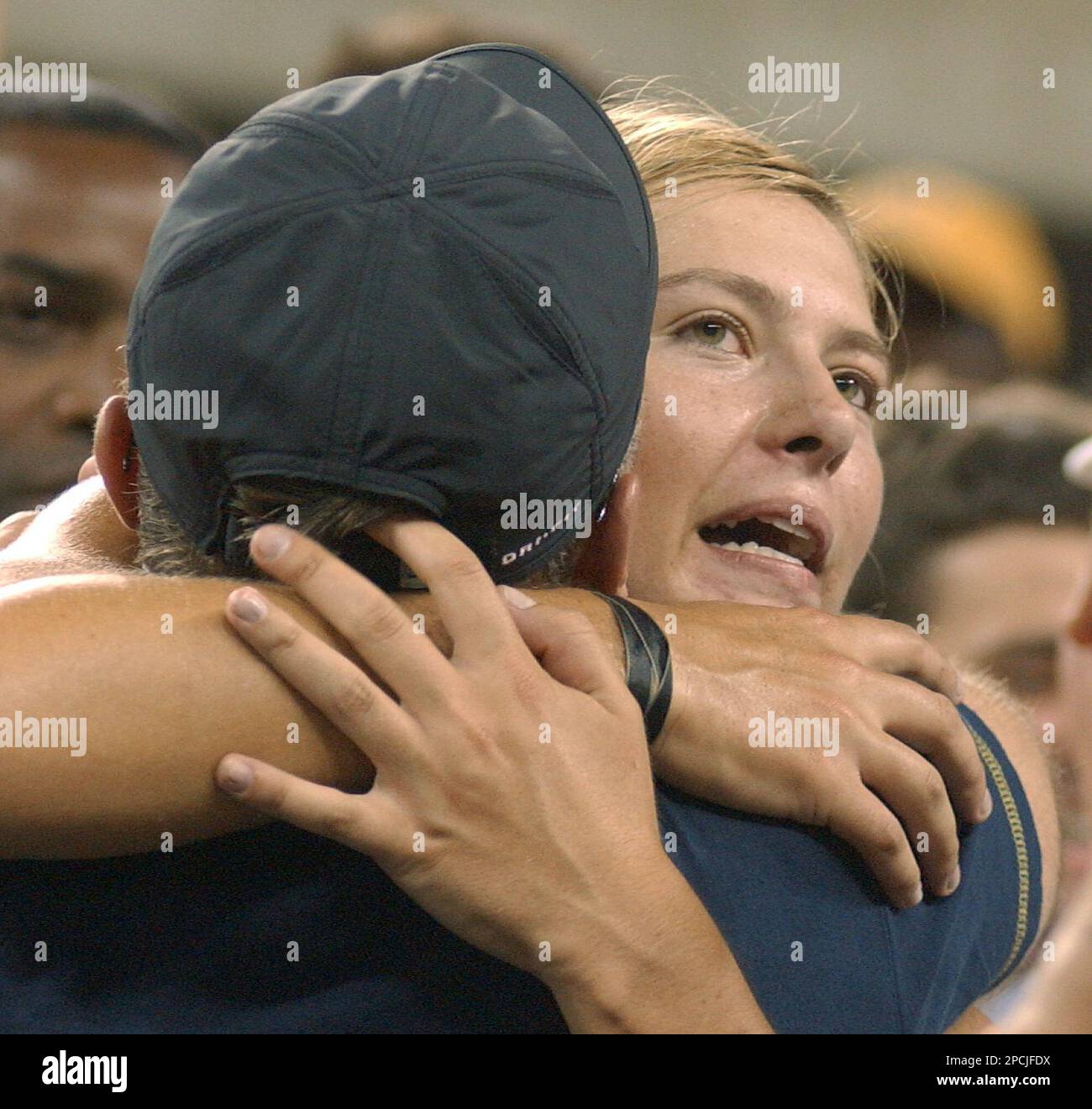 Maria Sharapova, of Russia, hugs her father, Yuri Sharapov, after ...