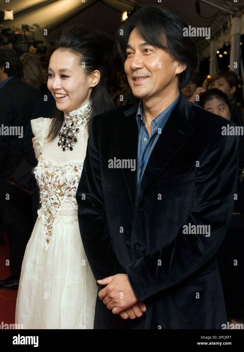 Actor Rinko Kikuchi, left, and Koji Yakusho arrive for the screening of ...
