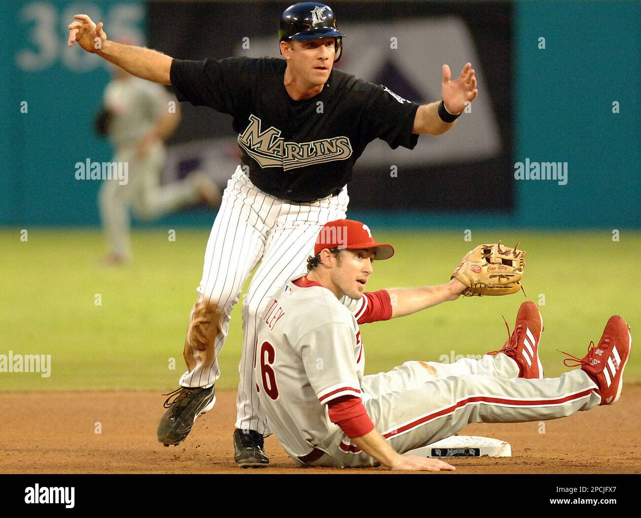Florida Marlins pinch runner Jason Wood, left, and Philadelphia ...