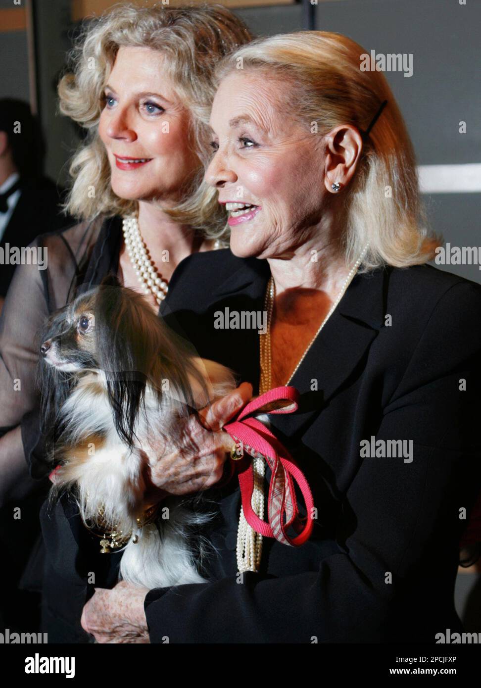 Actresses Blythe Danner, left, and Lauren Bacall, holding her dog ...