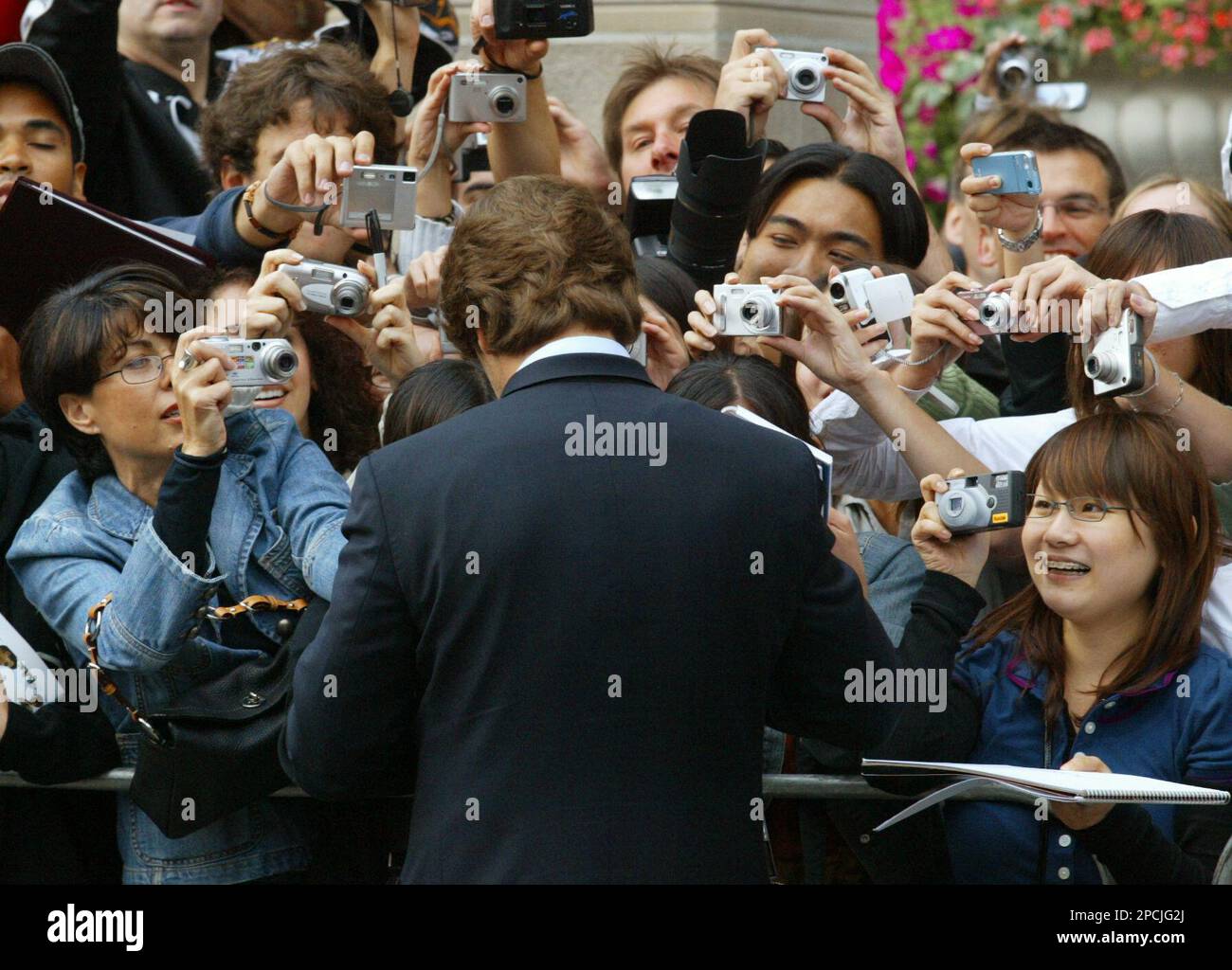Fans take pictures of Russell Crowe as he signs autographs at the ...