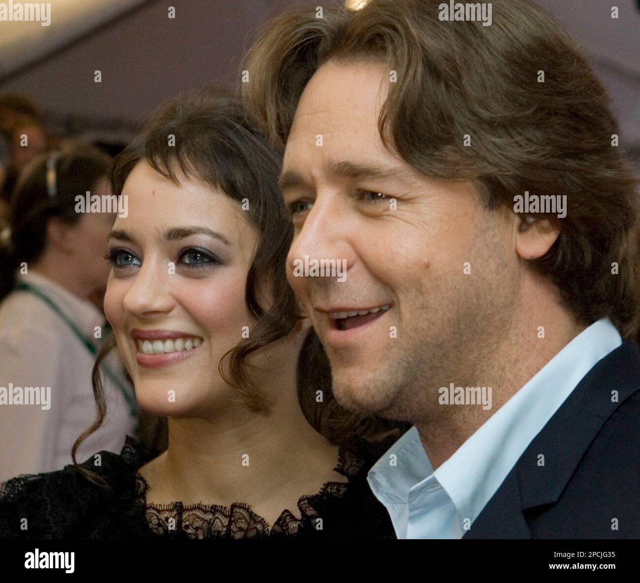 Actors Marion Cotillard and Russell Crowe pose for photographers as ...