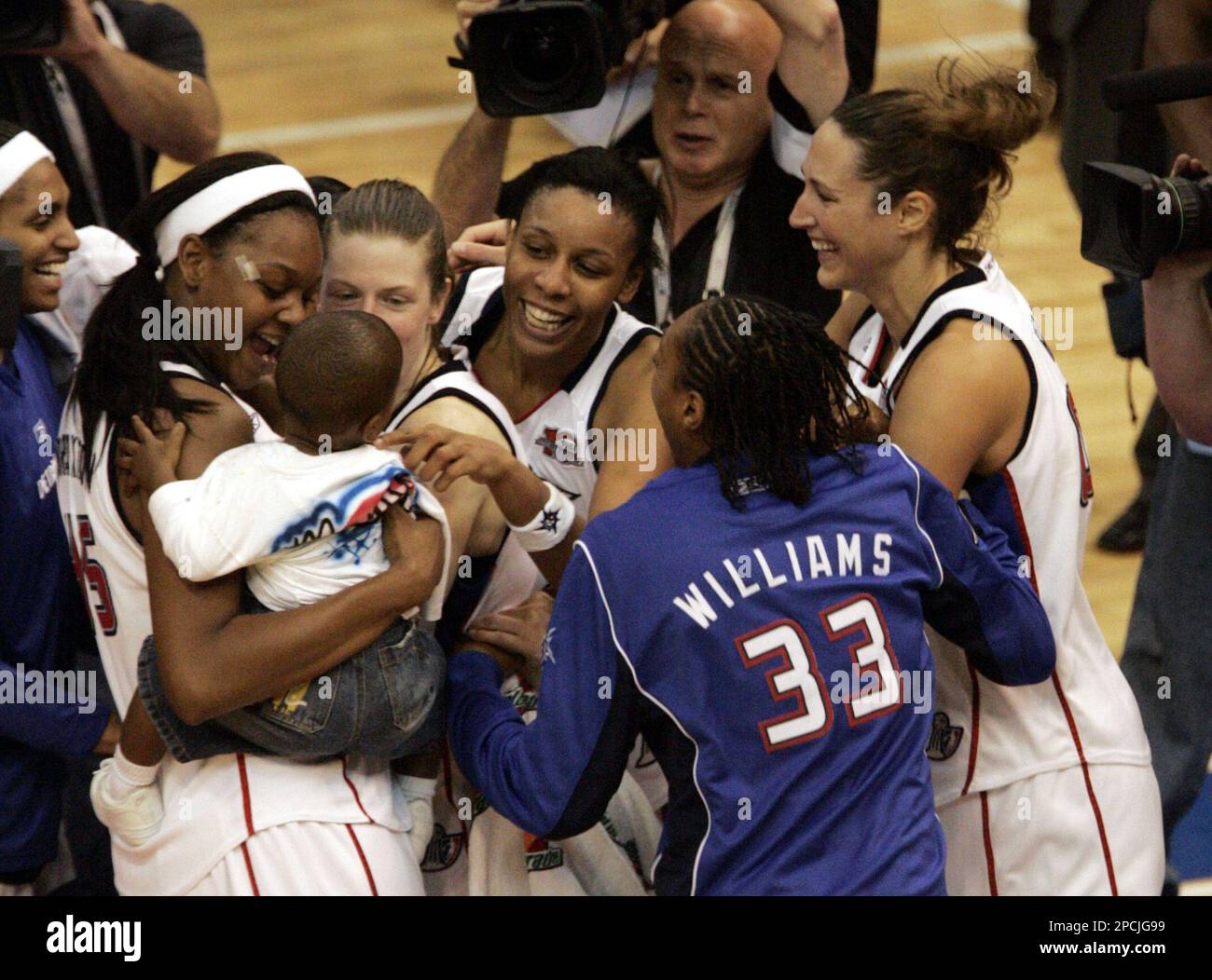 The Detroit Shock celebrate their 80-75 win at midcourt over the ...