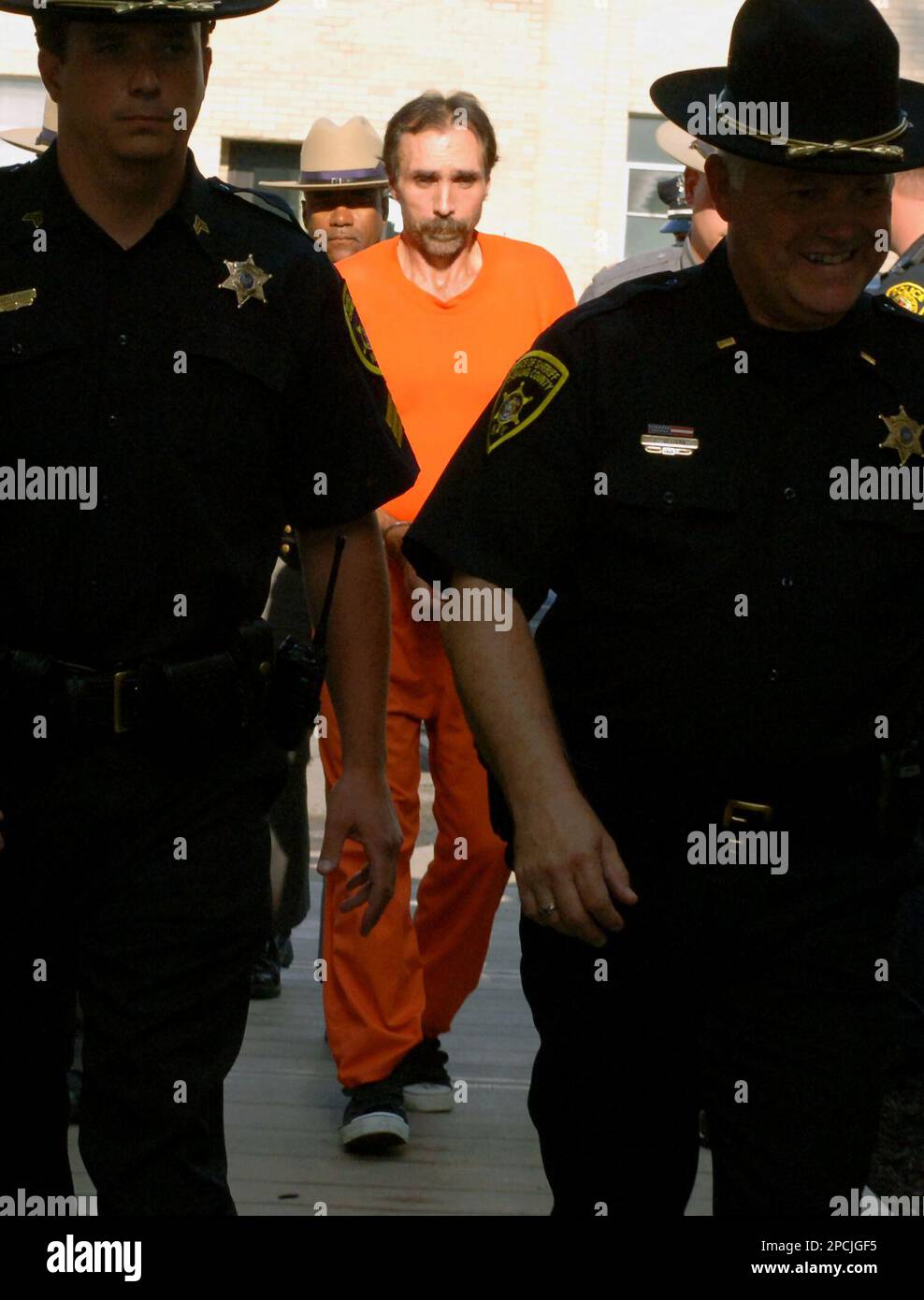 Chemung County Sheriffs escort Ralph "Bucky" Phillips toward the ...