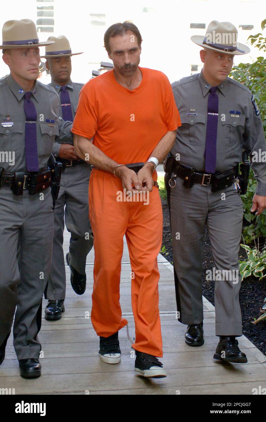 Chemung County Sheriffs escort Ralph "Bucky" Phillips toward the ...