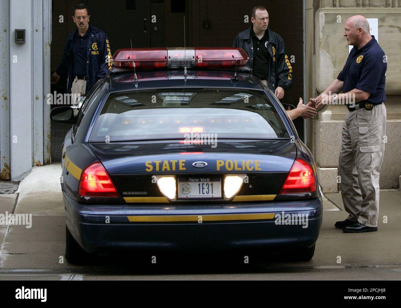 U.S. Marshals and N.Y. State Police leave the the U.S. District Court ...