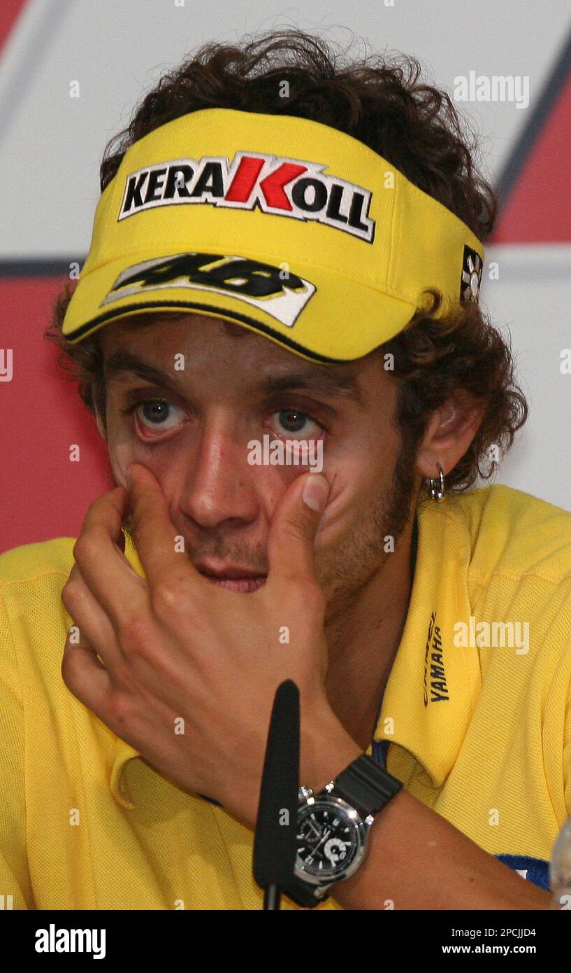 Italian Valentino Rossi rubs his eyes during press conference at Sepang ...