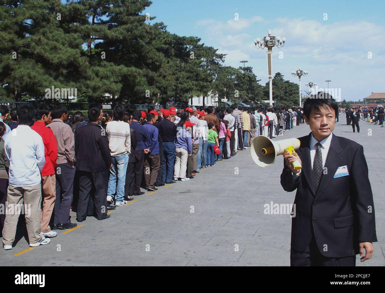 Visitors line up to view the embalmed body of the late Chairman Mao ...