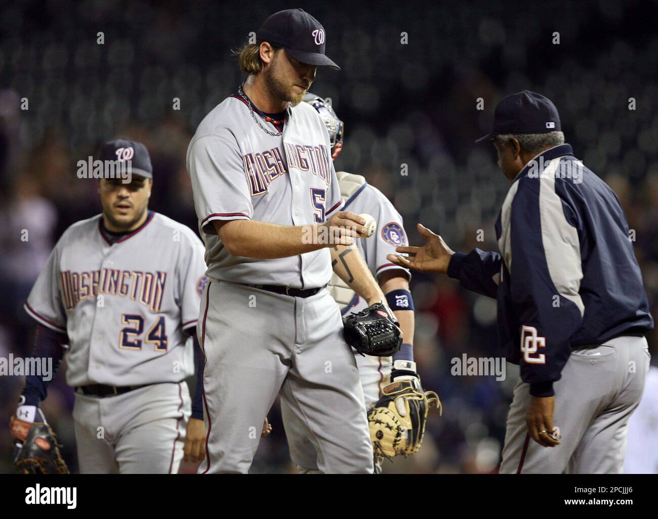 Washington Nationals relief pitcher Jon Rauch, front left, hands the ...