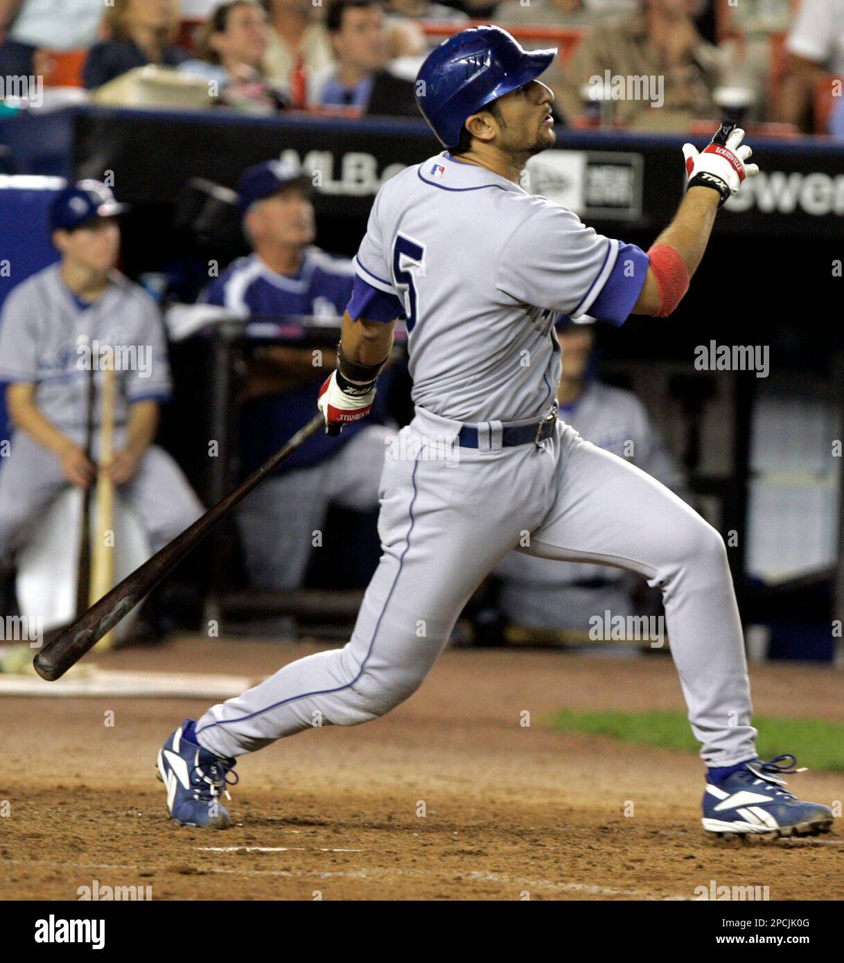 Los Angeles Dodgers' Nomar Garciaparra follows through on a home run ...