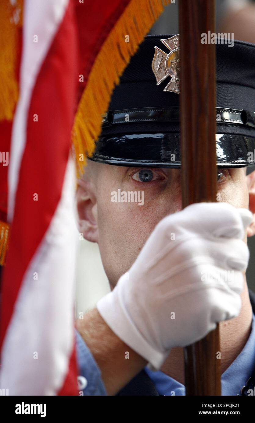 Firefighter Sam Erwin stands at attention during a ceremony Friday ...