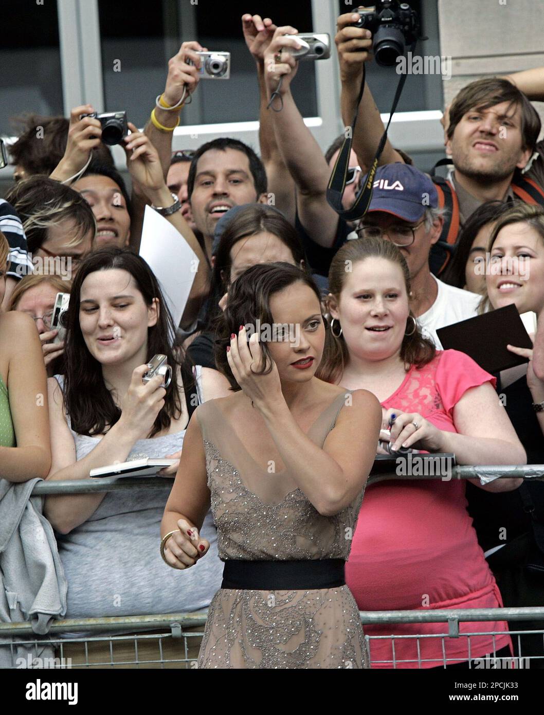 Fans try to take photos of actress Christina Ricci when she arrives for ...