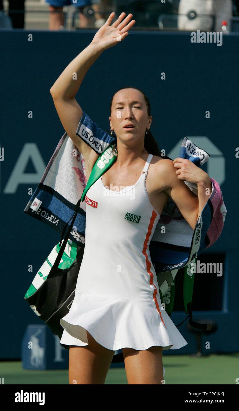 Jelena Jankovic, of Serbia, waves after being defeated by Justine Henin ...
