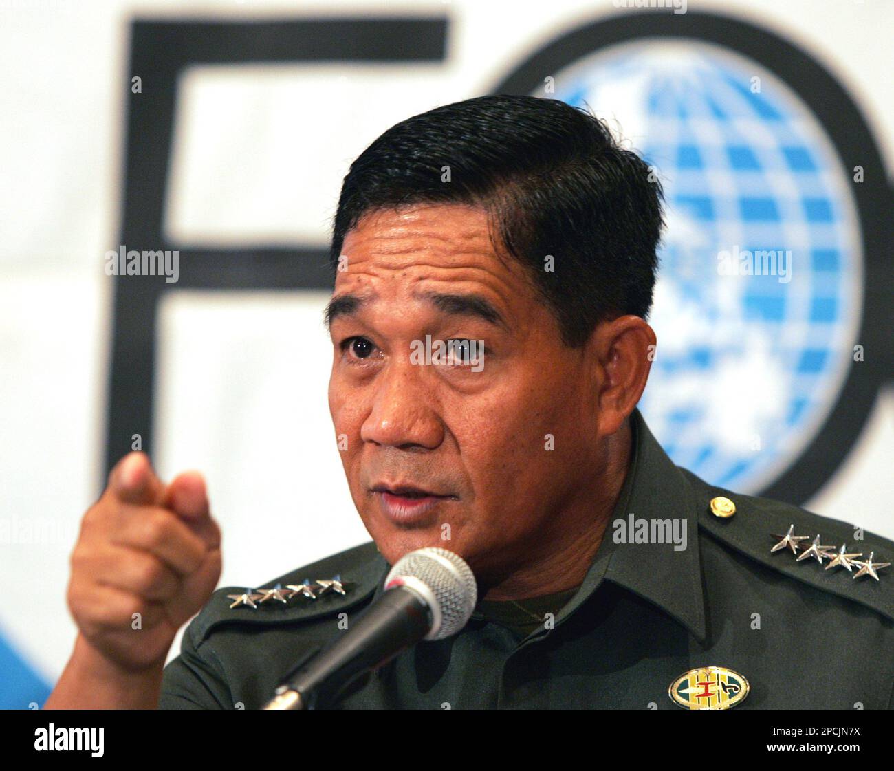 Philippine Armed Forces Chief Gen. Hermogenes Esperon Jr. gestures ...
