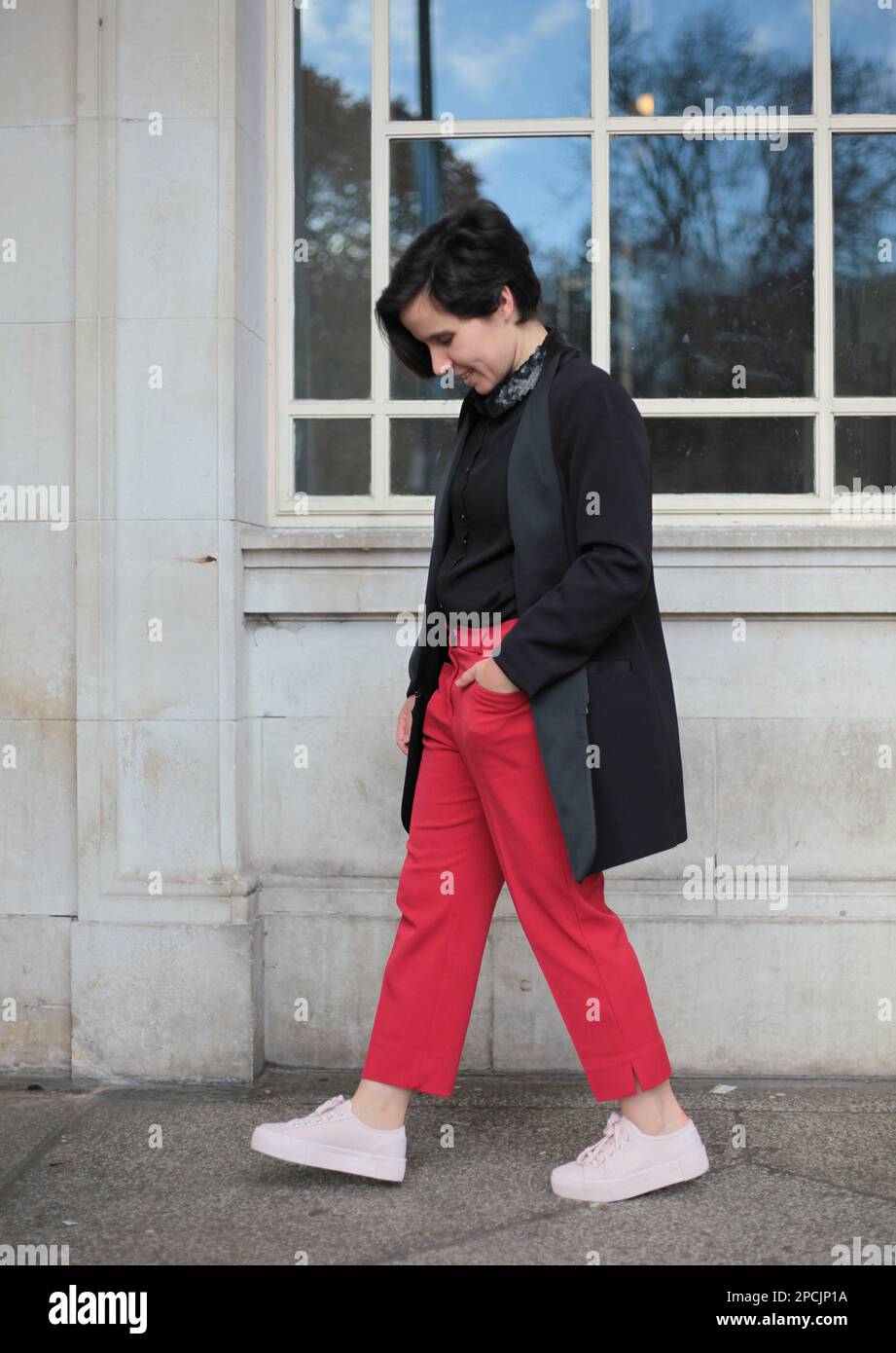 Stylish woman in pink jacket hi-res stock photography and images - Alamy