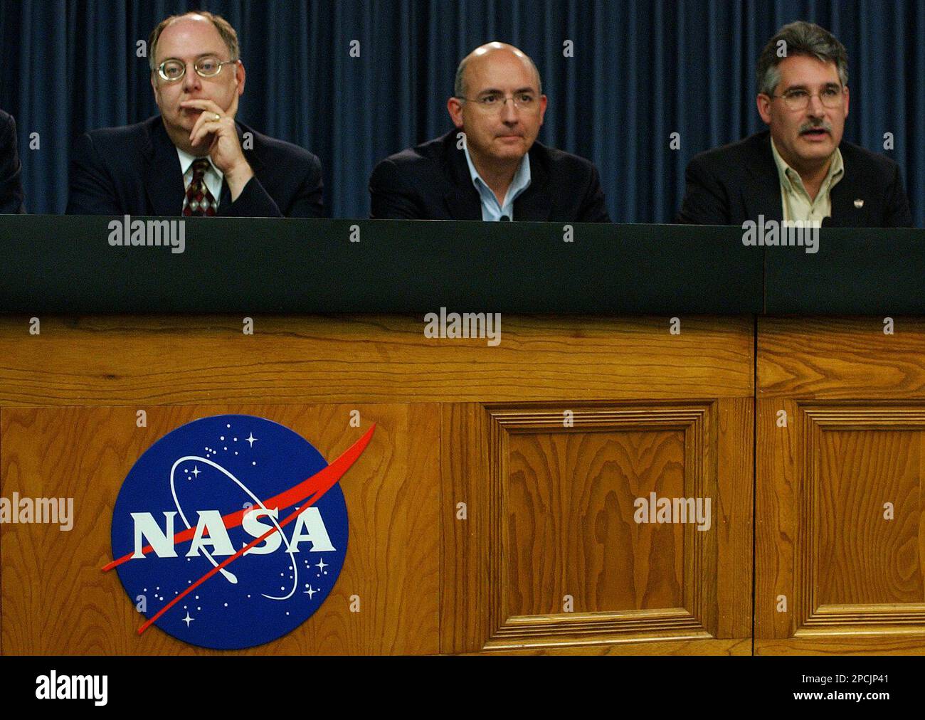 Steve Poulos, space shuttle orbiter project manager, right, speaks ...