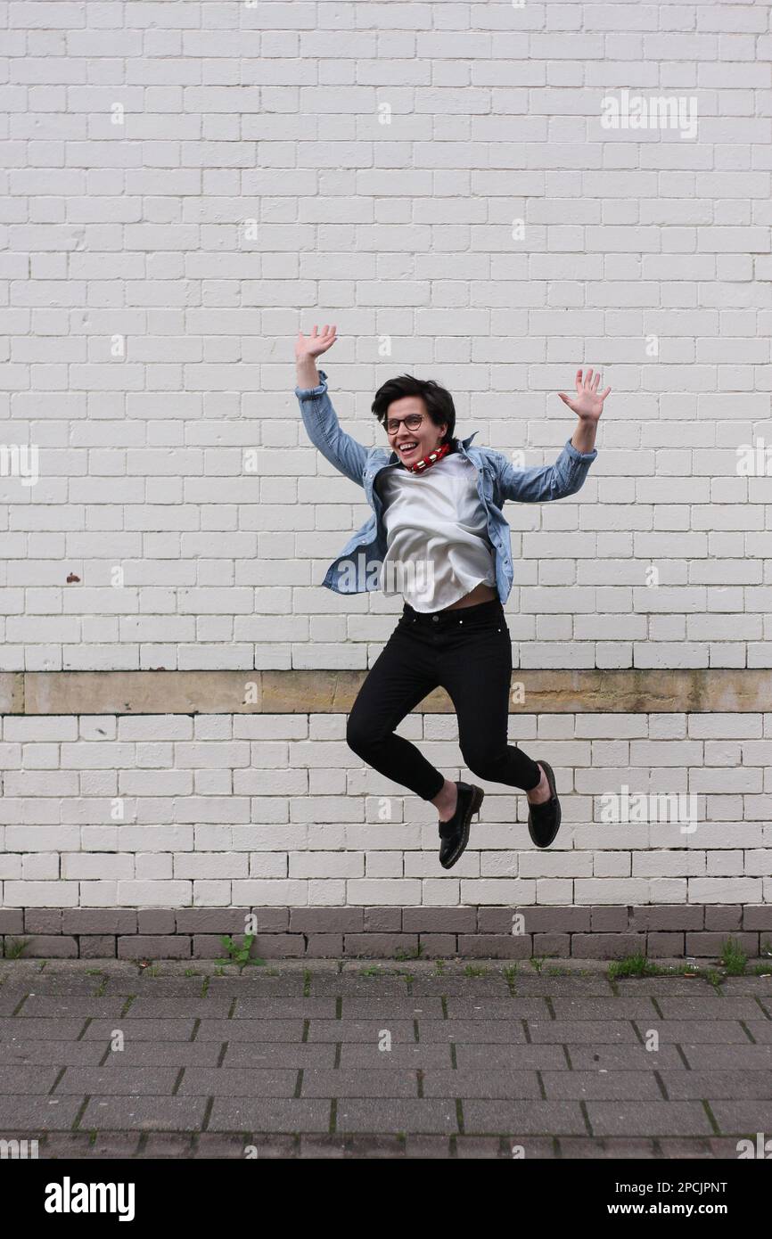 Girl jumping high hi-res stock photography and images - Alamy