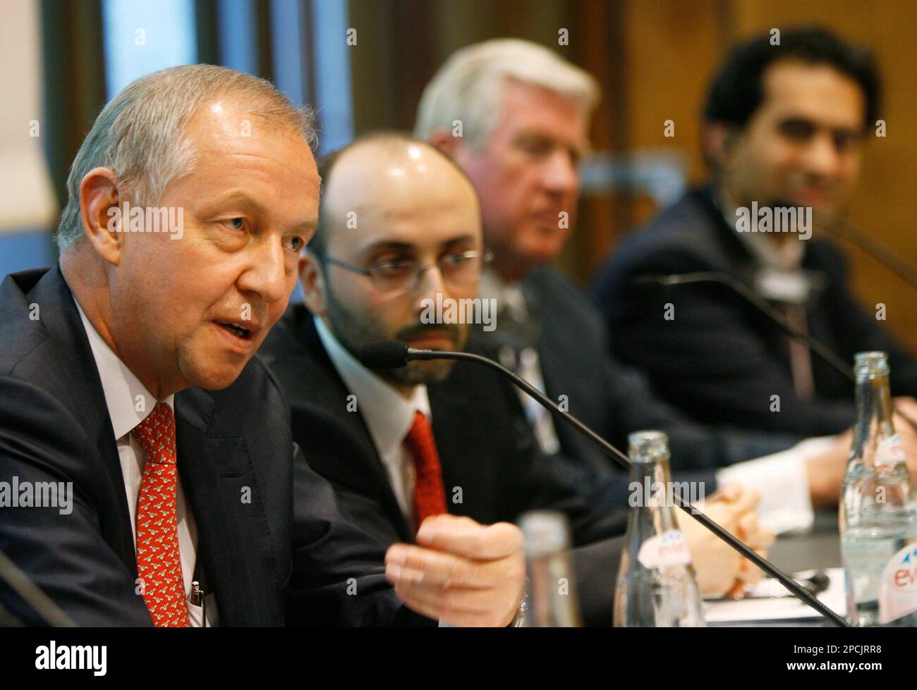 Hans Lerch, CEO of aircraft maintenance firm SR Technics, left, talks ...