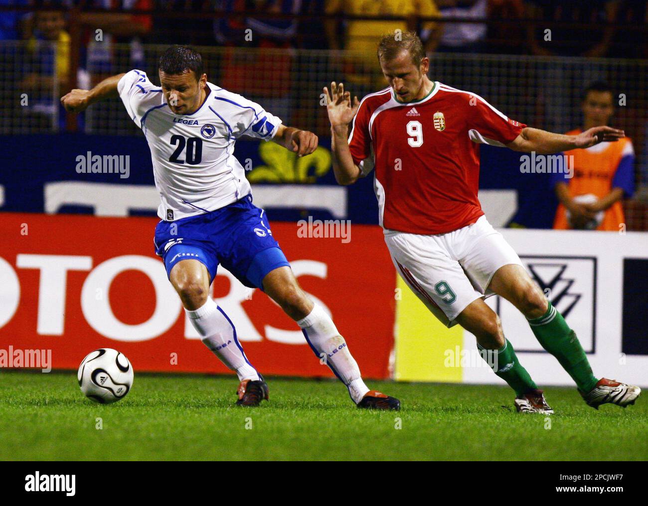 Bosnian player Vule Trivunovic, left, challenges for the ball with ...