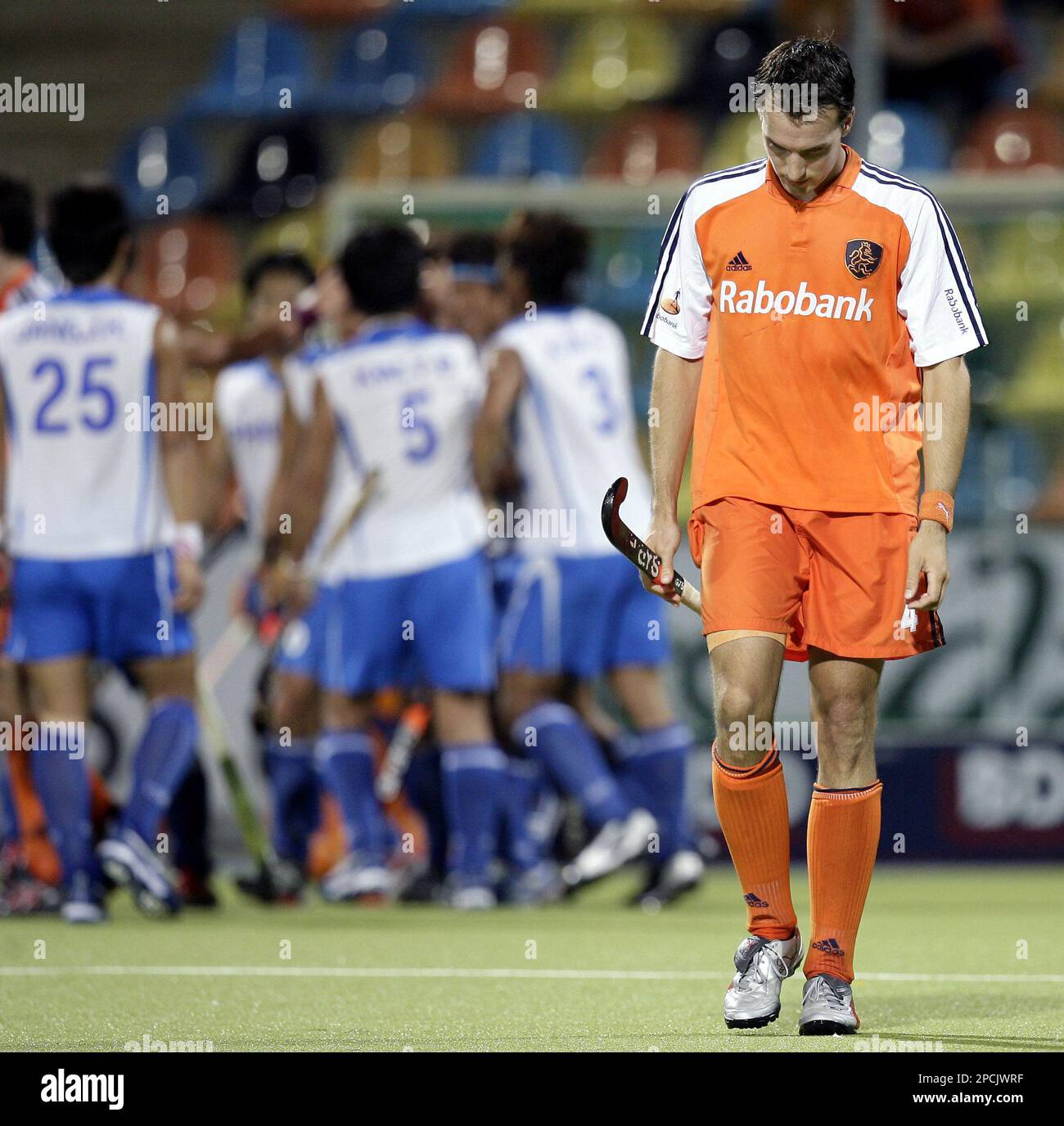 Dutch player Karel Klaver, right, reacts while Korea's players ...