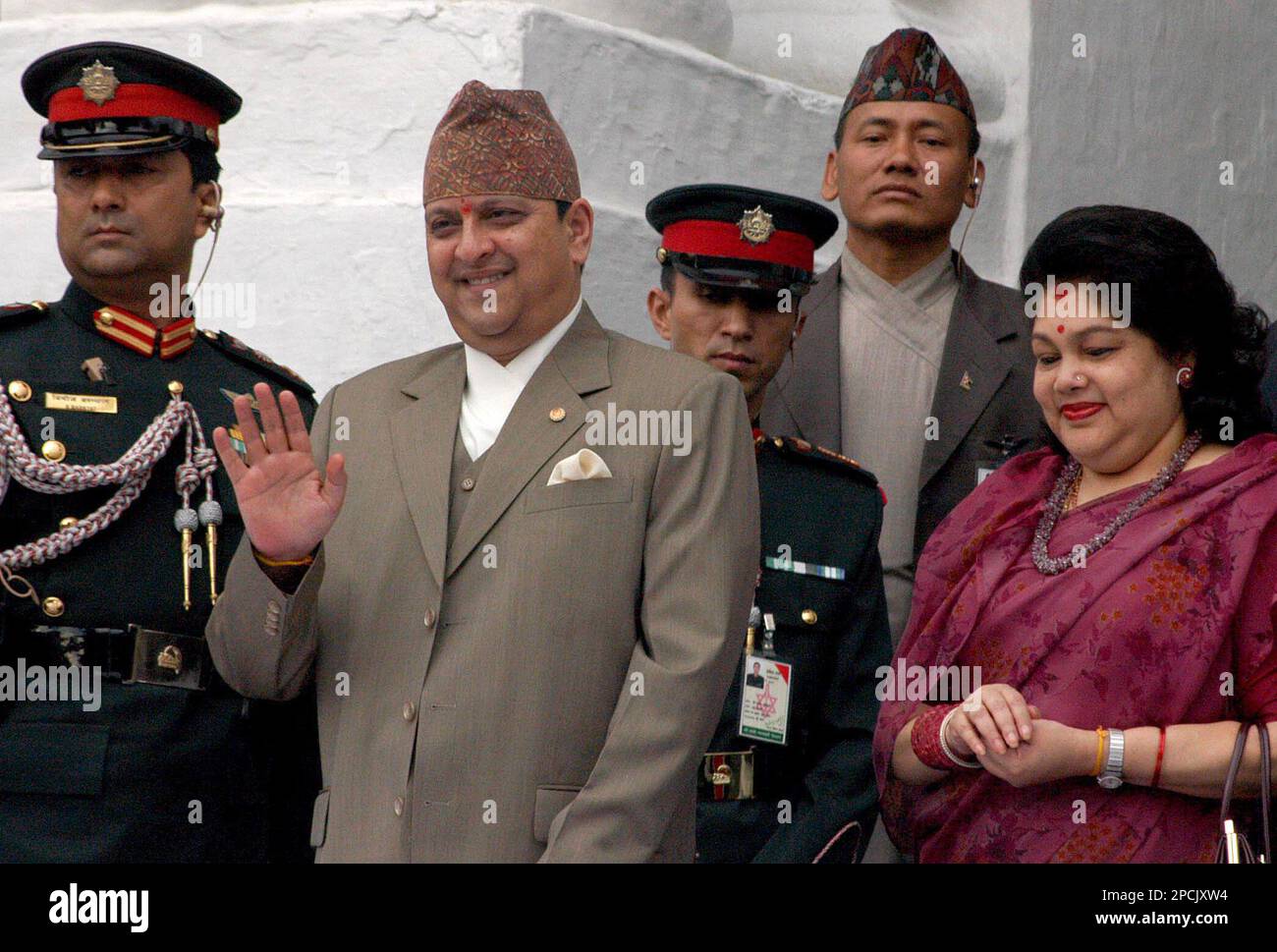 Nepal's King Gyanendra, second left, and Queen Komal, right, wave ...