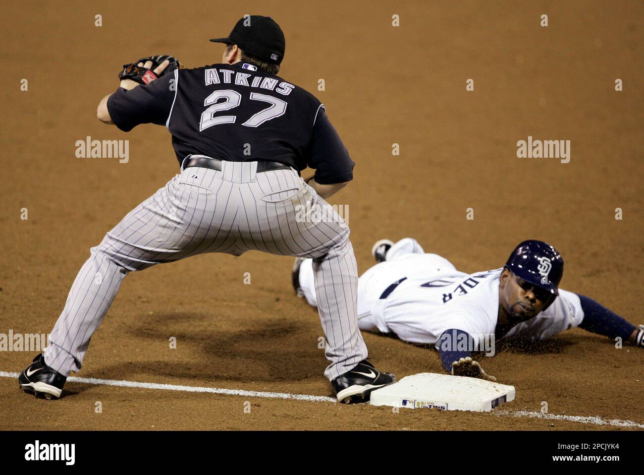 San Diego Padres' Manny Alexander slides safely into third with an RBI ...