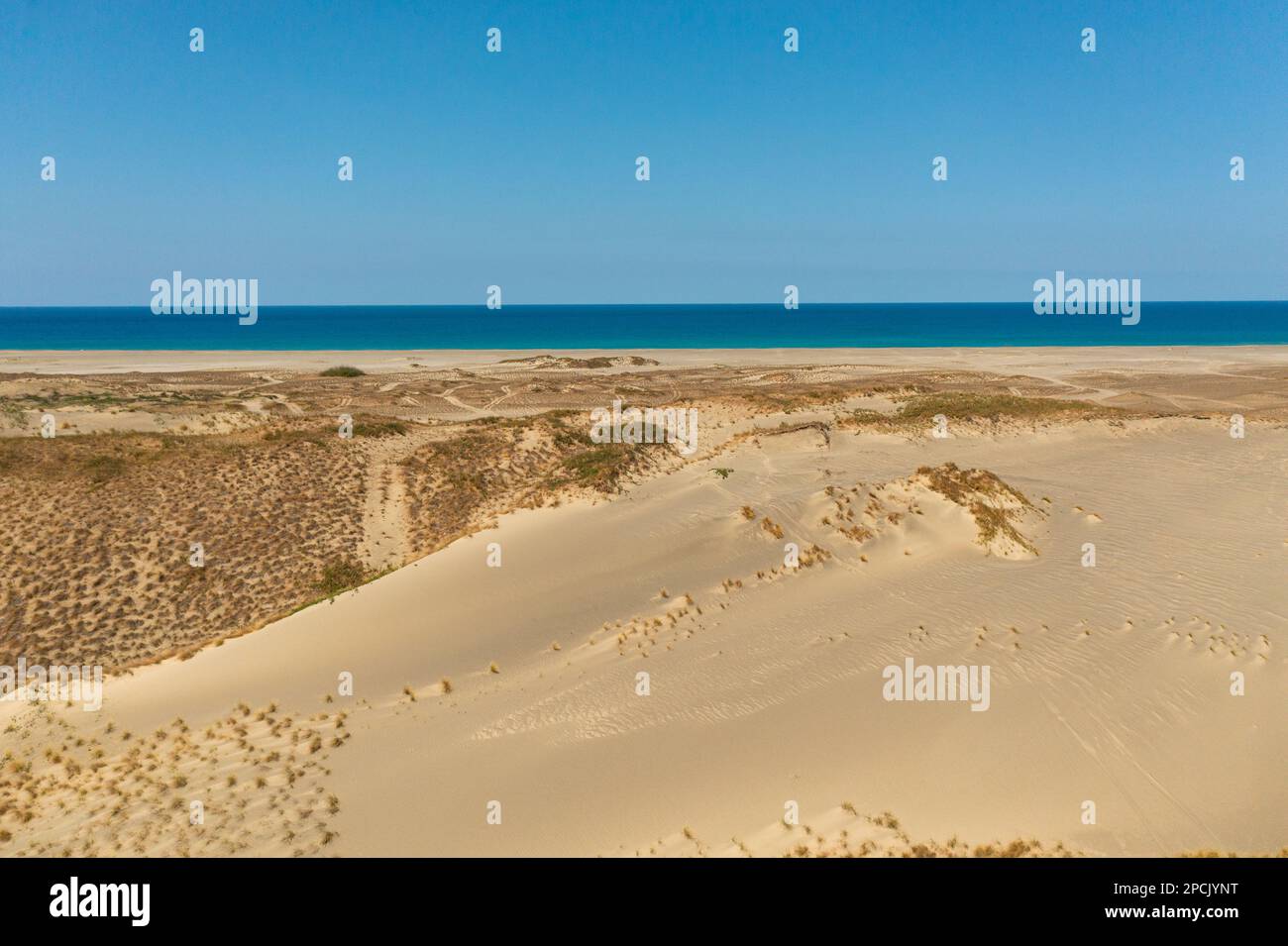 Aerial view of Tropical sandy beach and blue sea. Paoay Sand Dunes ...