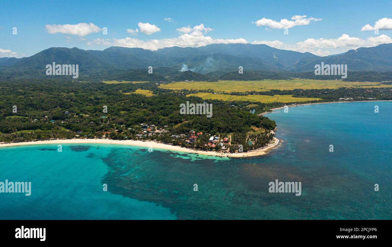 Tropical landscape with a beautiful beach in the blue water. Pagudpud ...