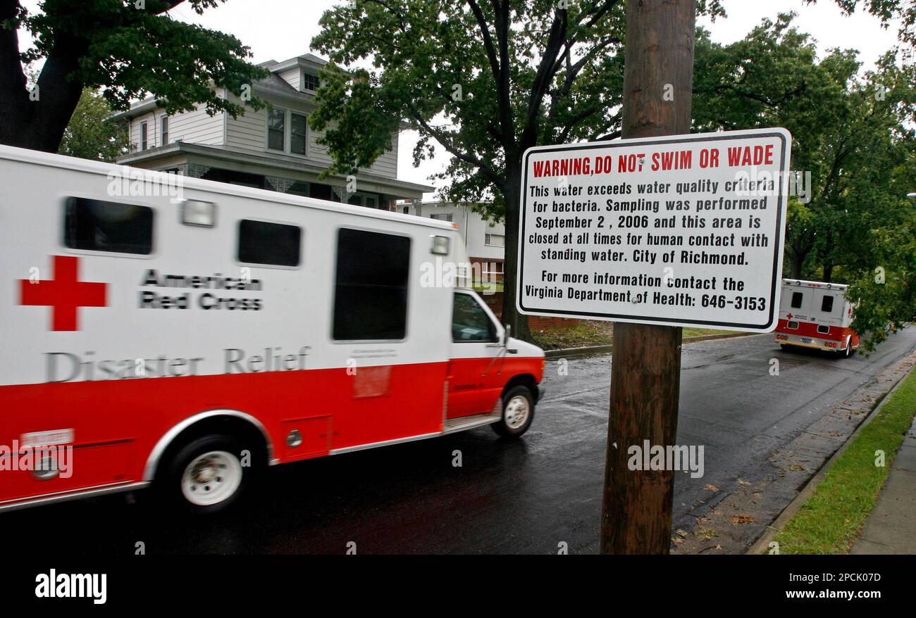 Red Cross trucks travel through Battery Park area of Richmond, Va. with ...