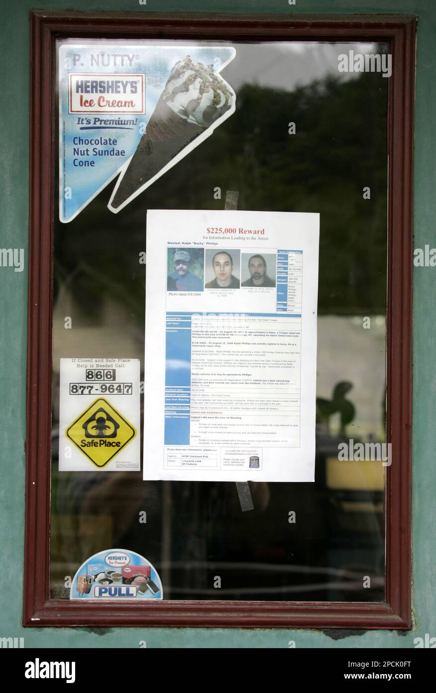 A wanted poster for fugitive Ralph "Bucky" Phillips hangs in the front ...