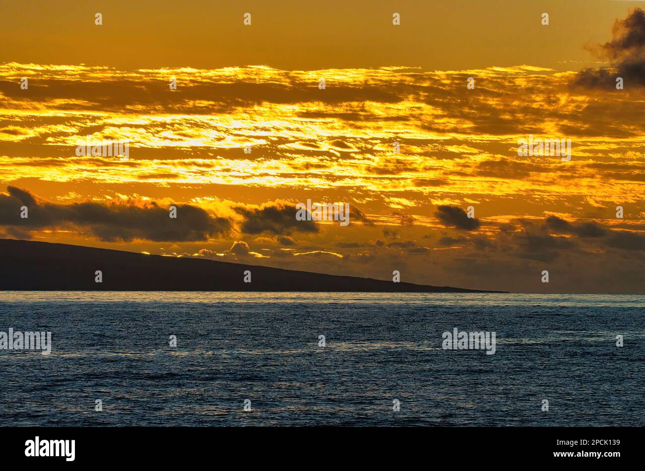 Sky ablaze with color during a sunset on maui Stock Photo - Alamy