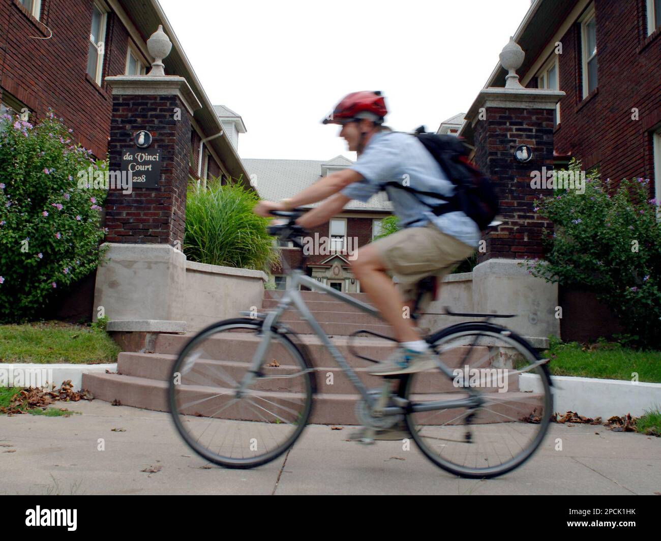 Bruce Wilbur rides his bicycle past the apartment complex he lives in ...
