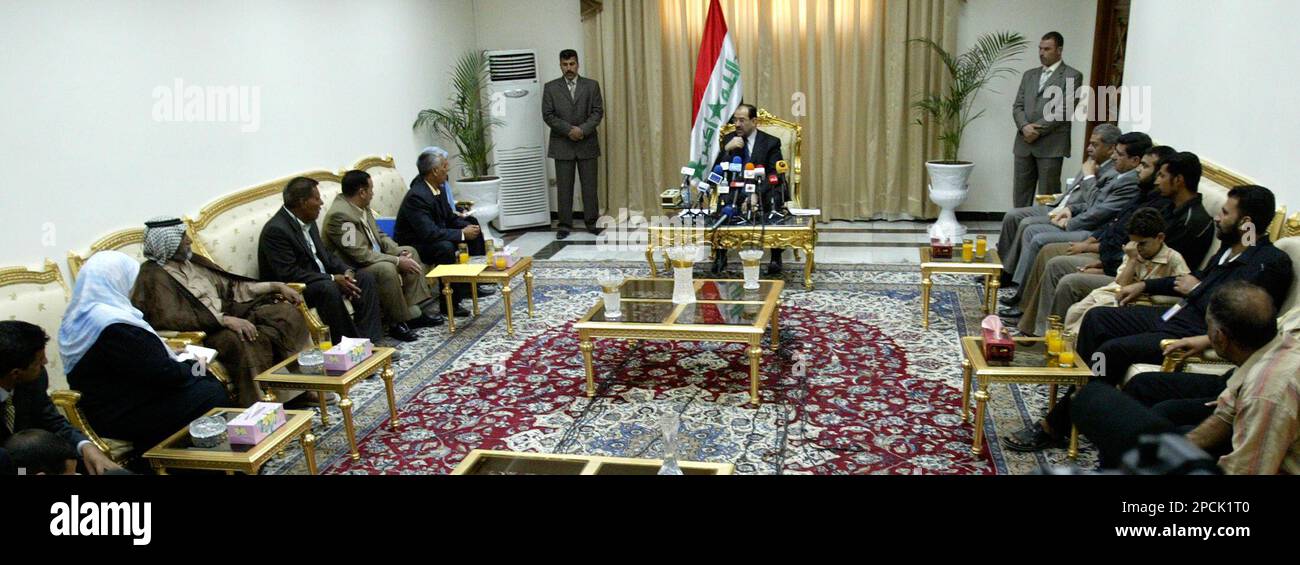 Iraqi Prime Minister Nouri Al Maliki Center Speaks During A Meeting