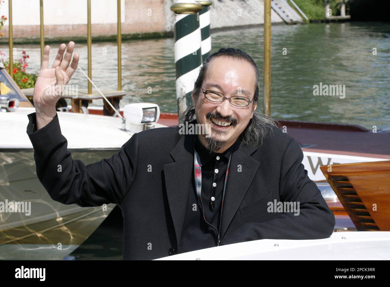 Japanese director Kon Satoshi waves from a boat at the 63rd edition of ...
