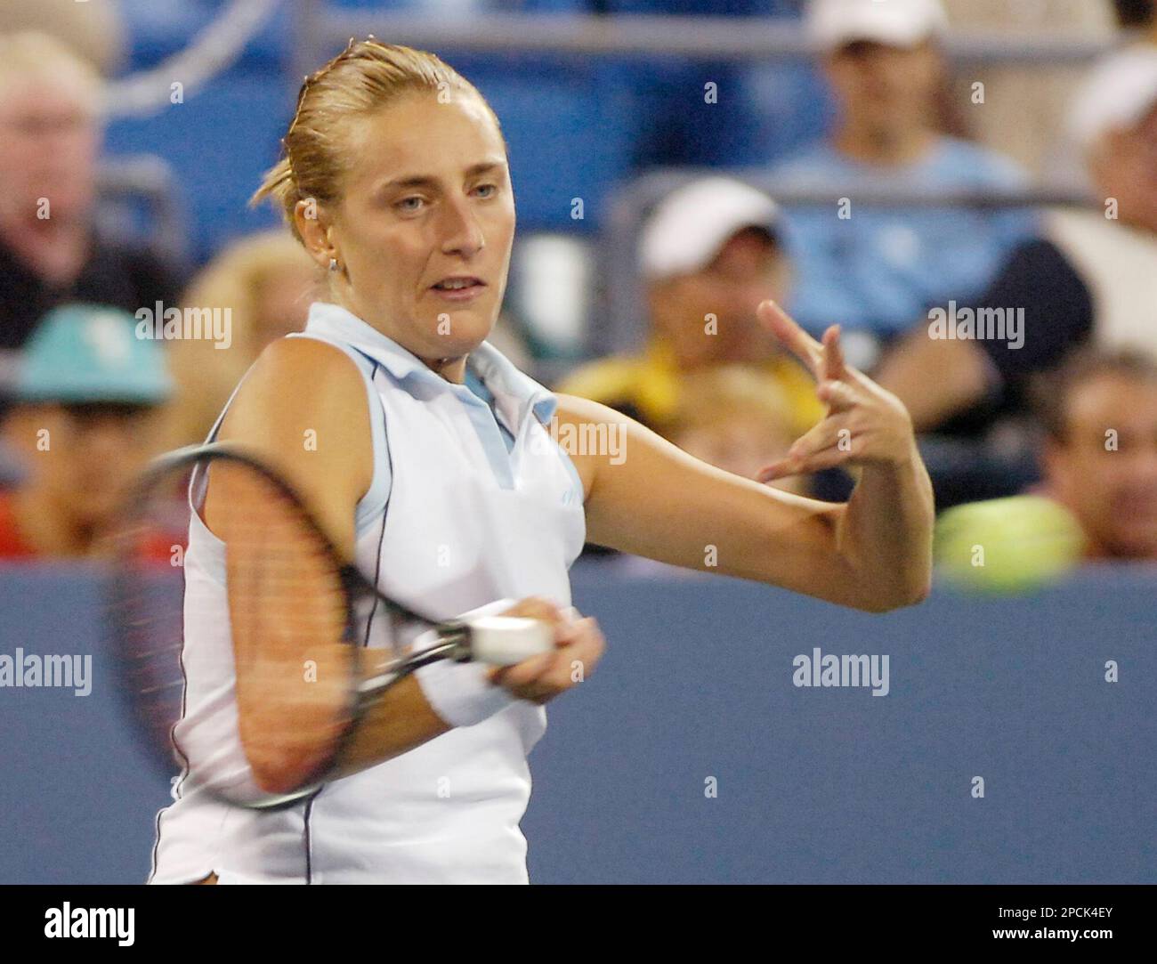 Mara Santangelo of Italy returns a shot during her match at the US Open ...